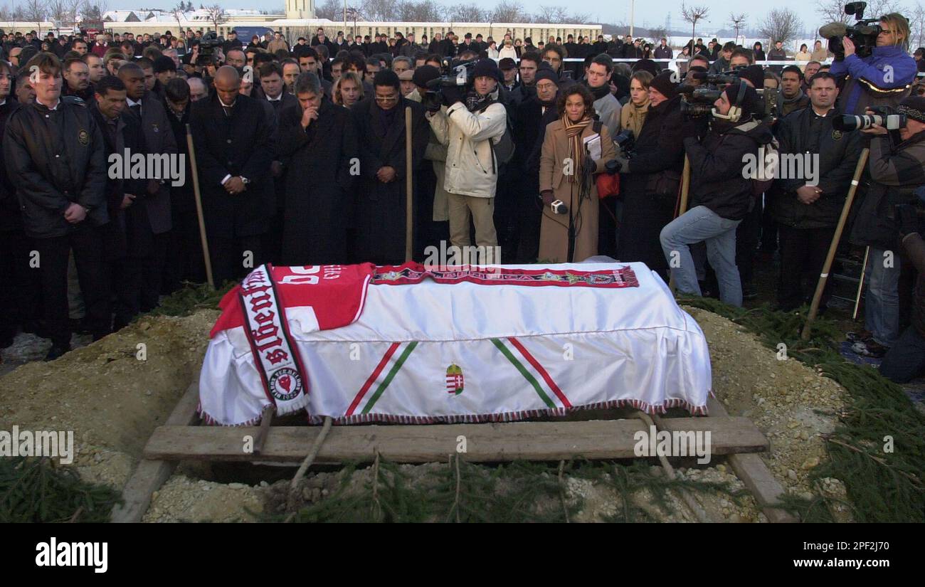 Benfica soccer players and fans surround the coffin of Miklos Feher ...