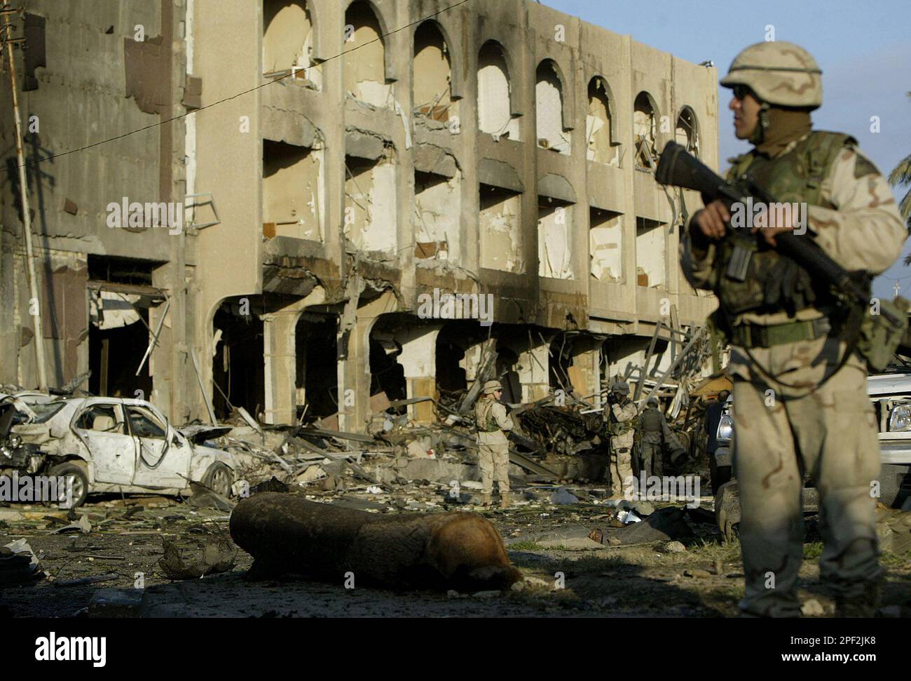 U.S. troops secure the area of an explosion at a Baghdad hotel ...