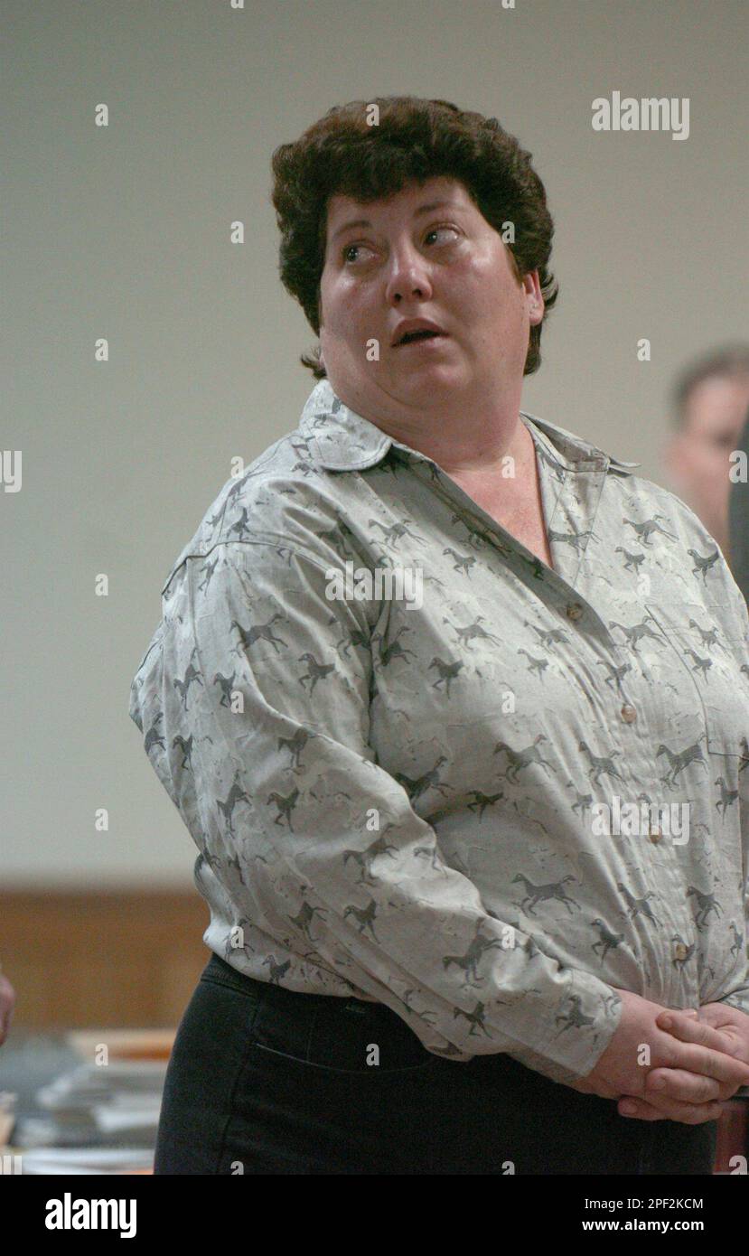 Rhonda Cloer looks toward her attorney after hearing the terms of her ...