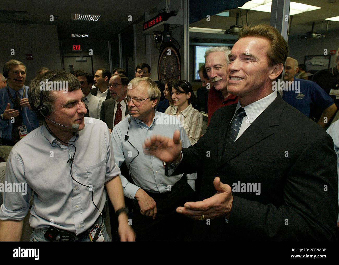 ** POOL PHOTO ** Calif. Gov. Arnold Schwarzenegger, right, cheers with ...