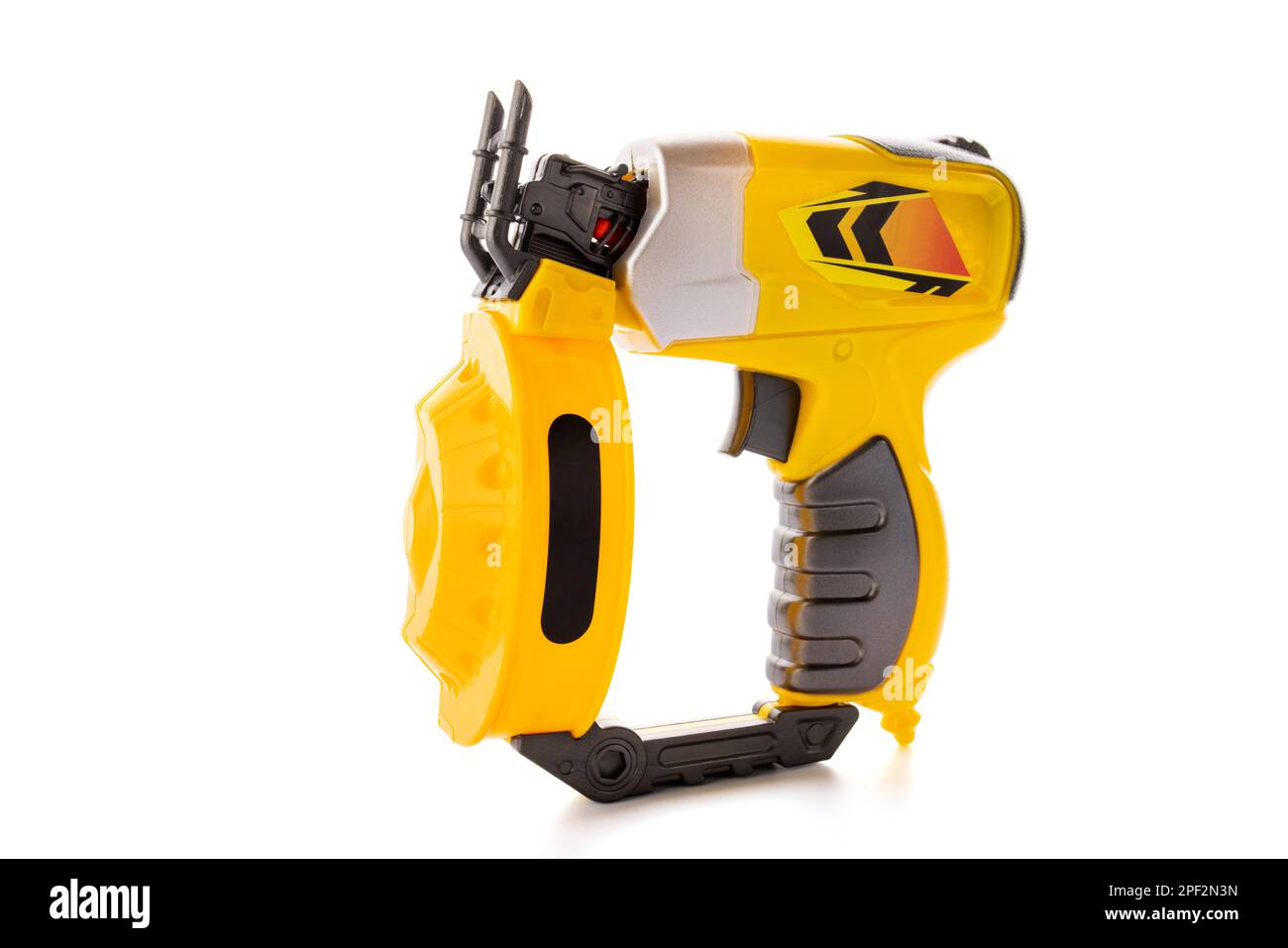 Yellow plastic toy pneumatic nail gun isolated on white background ...