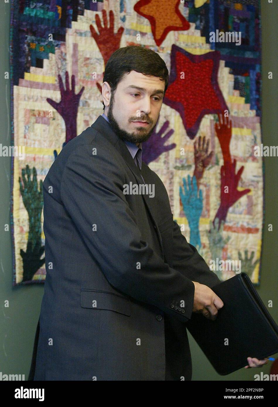 Syrian-born Canadian Maher Arar leaves a news conference in Ottawa ...