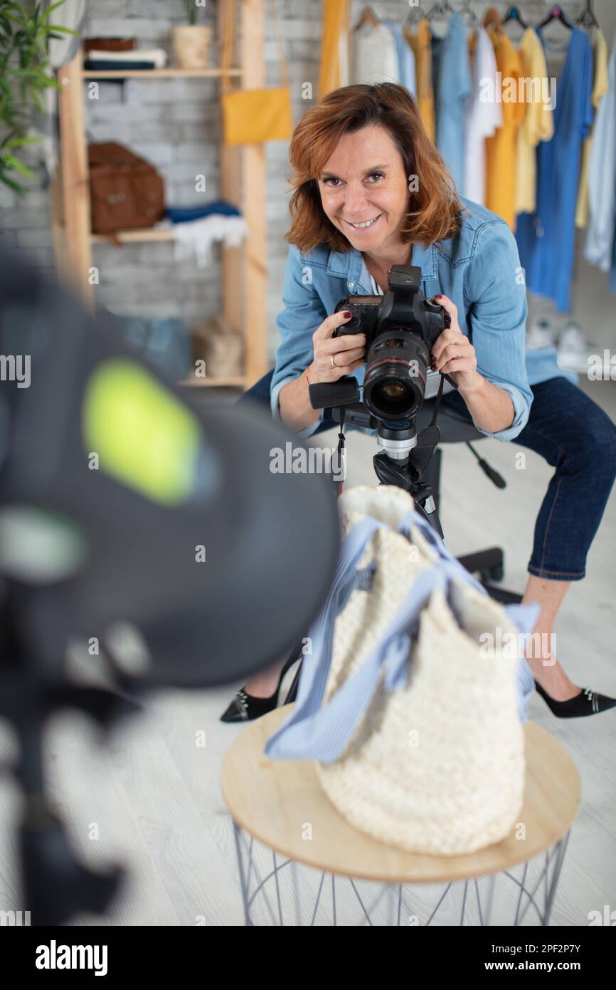 female professional photographer taking clothes photos Stock Photo - Alamy