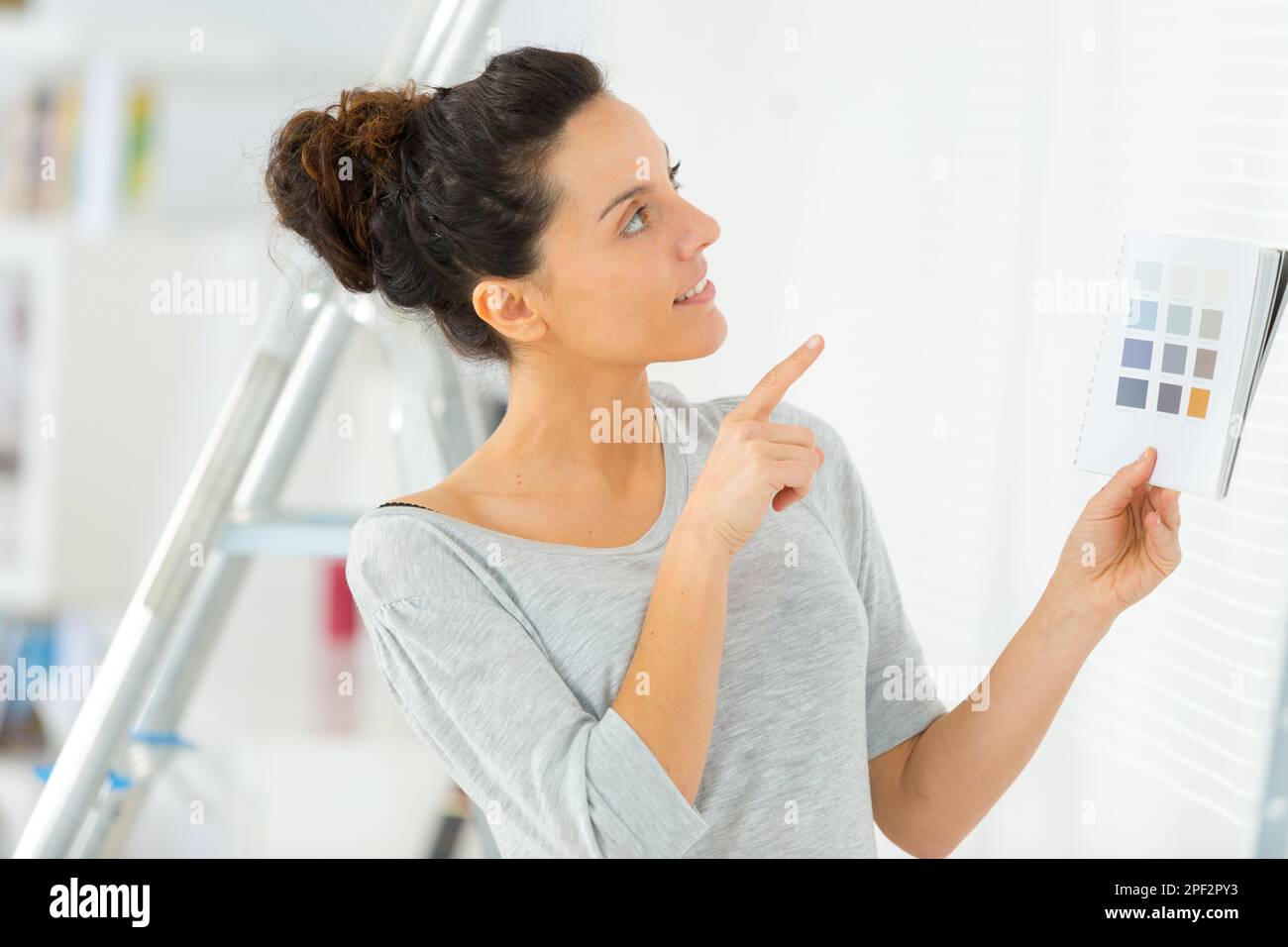 woman considering color scheme for redecorating Stock Photo - Alamy