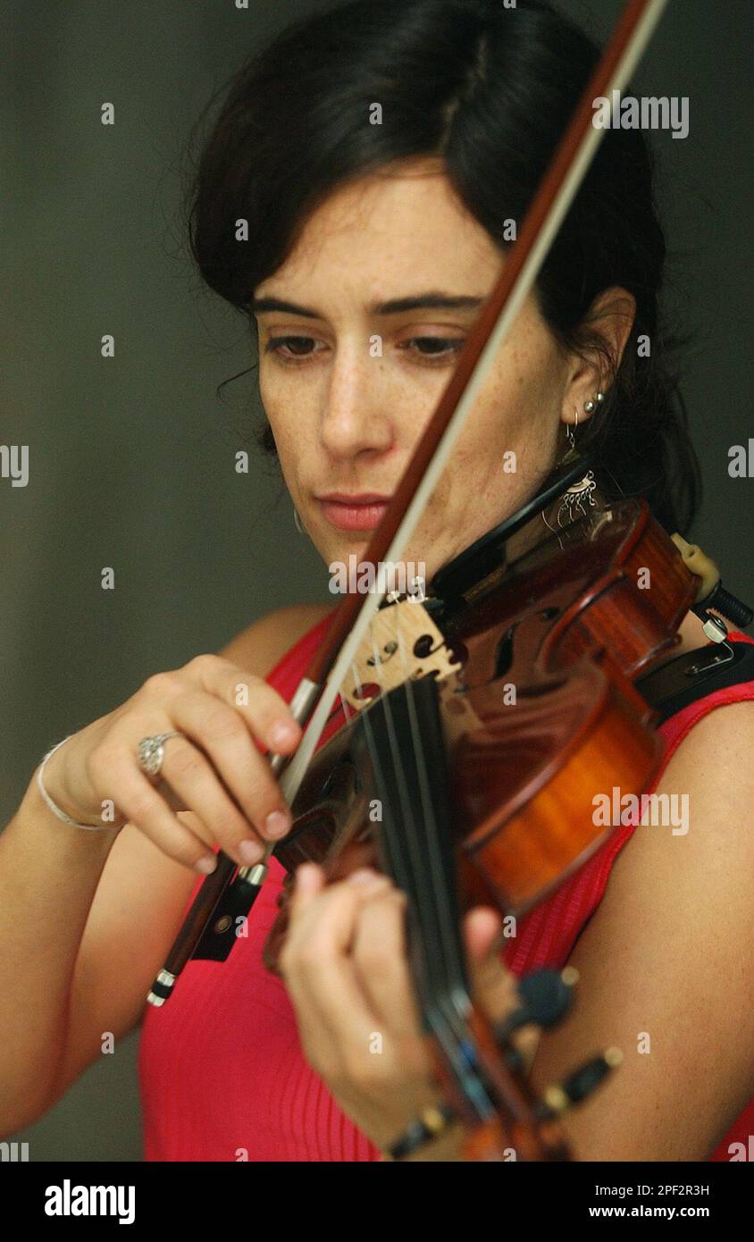American Christine Brebes, 30, rehearses at her house in Buenos Aires ...