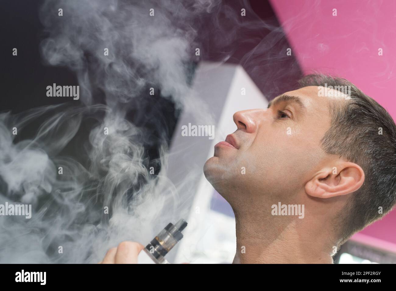 a man smoking with vaporizer Stock Photo - Alamy
