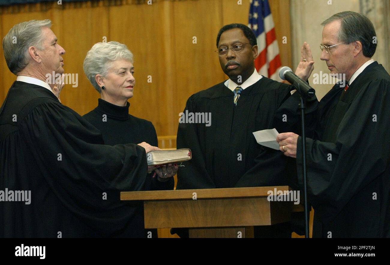 Federal judge Charles Pickering, left, recites the oath of office, as ...