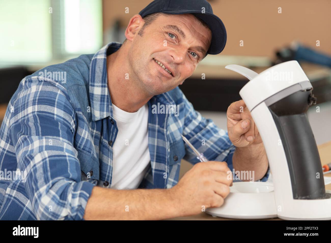 Male repairman coffee machine hi-res stock photography and images - Alamy