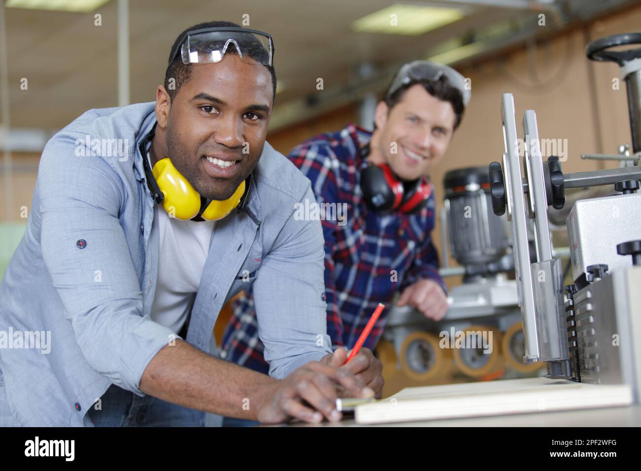 portrait of two carpenters at work Stock Photo - Alamy