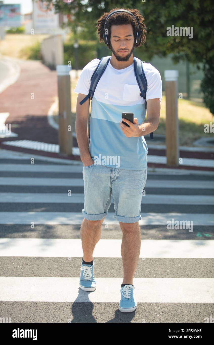 attractive guy walking on pedestrian crossing or crosswalk Stock Photo ...