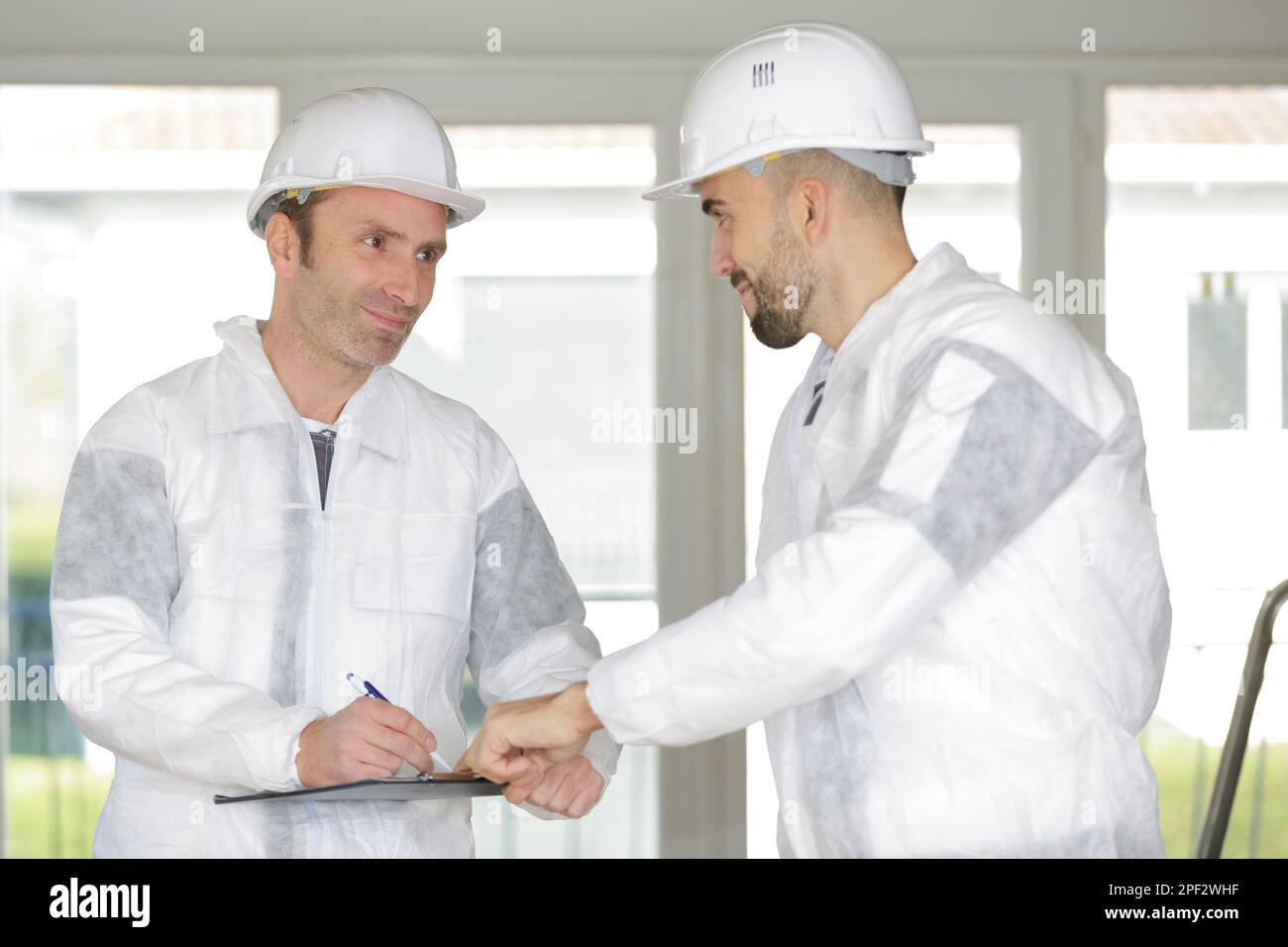 builders relaxing during break on site Stock Photo - Alamy