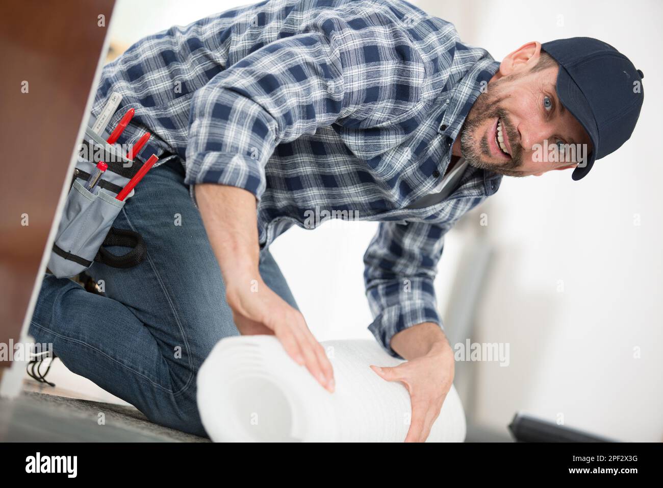 man rolling out new flooring indoors Stock Photo - Alamy man rolling out new flooring indoors Stock Photo - Alamy