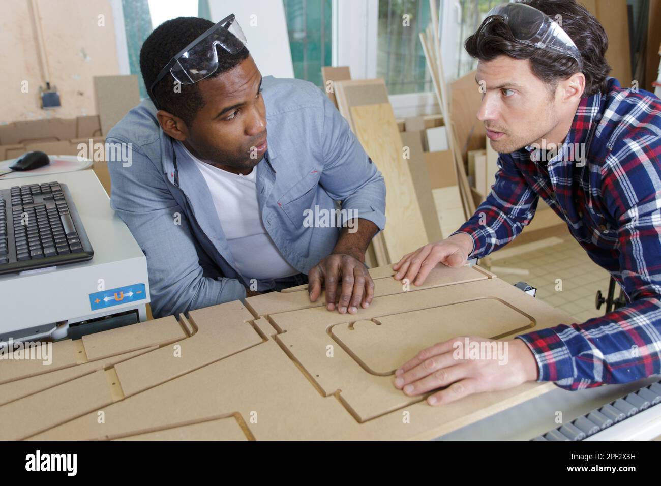 two carpenters work in the workshop Stock Photo - Alamy
