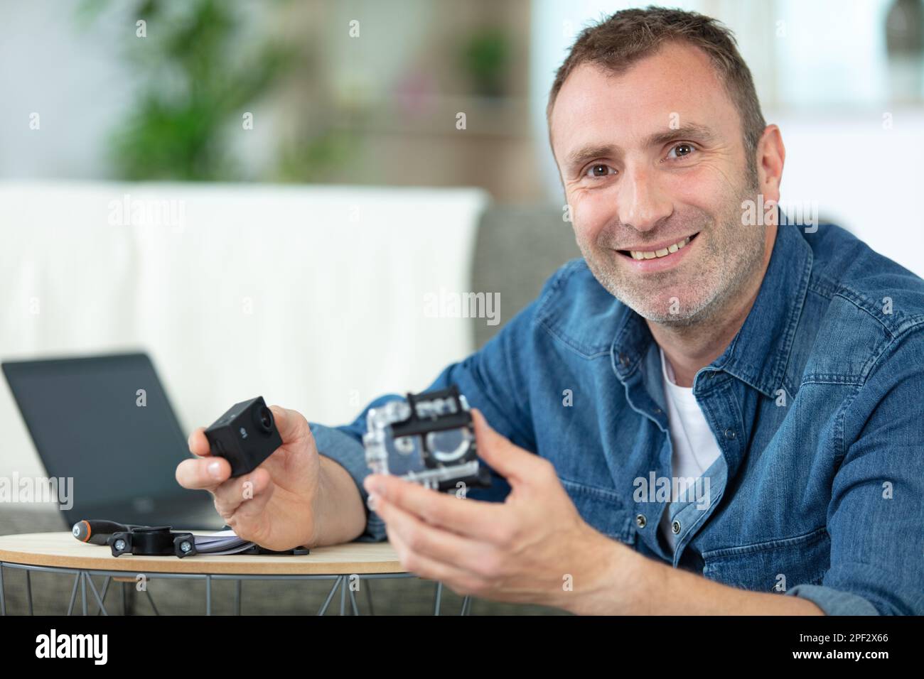 a happy man transfering photos Stock Photo - Alamy