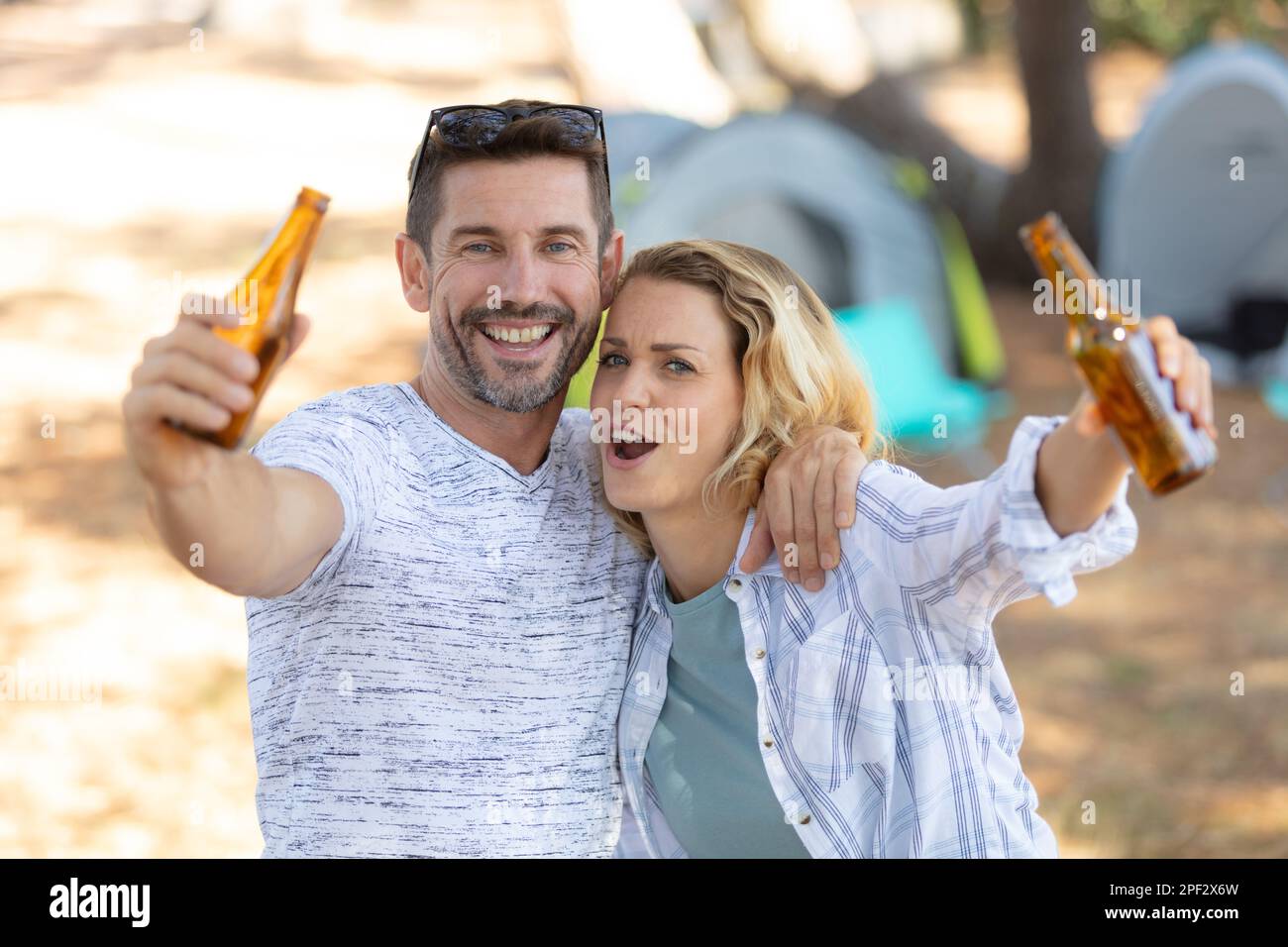couple in love celebrating with beers Stock Photo - Alamy