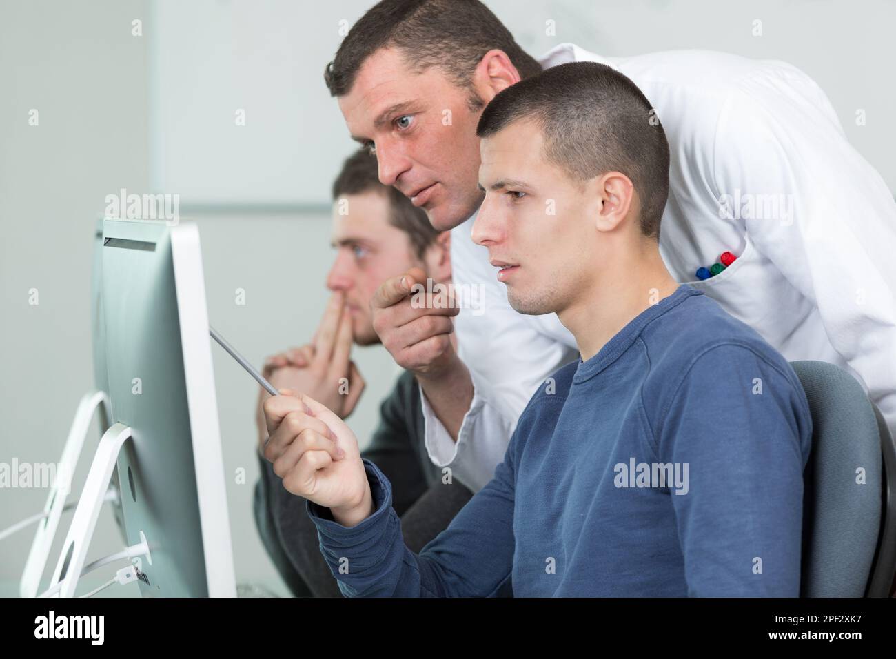male students solving problems on the computer Stock Photo - Alamy