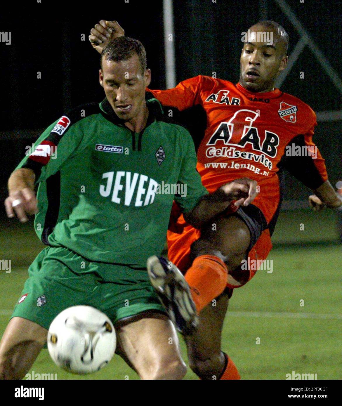 Borussia Moenchengladbach's player Strasser, left, fights for the ball ...