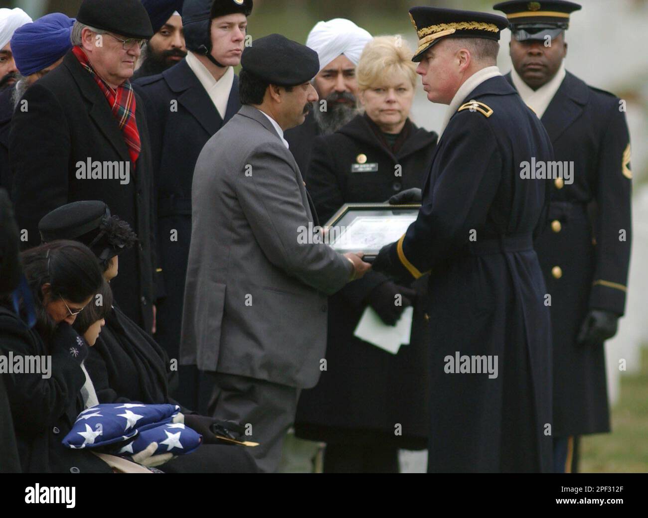 Retired Lt. Col. Preet Mahinder Singh, center, receives U.S ...