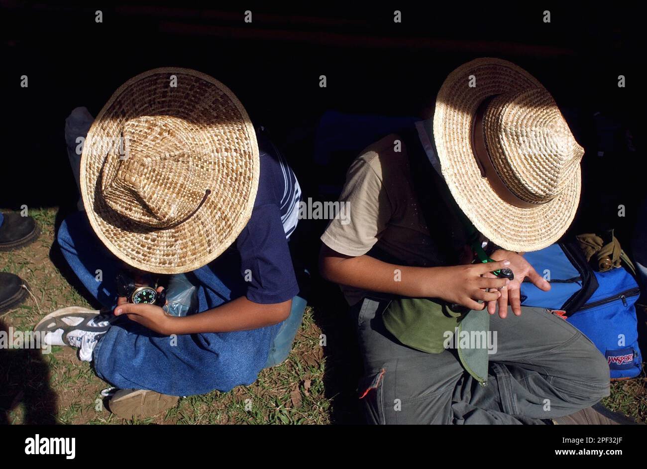 Scouts check their compasses at the XX Central American Scout Camp in ...