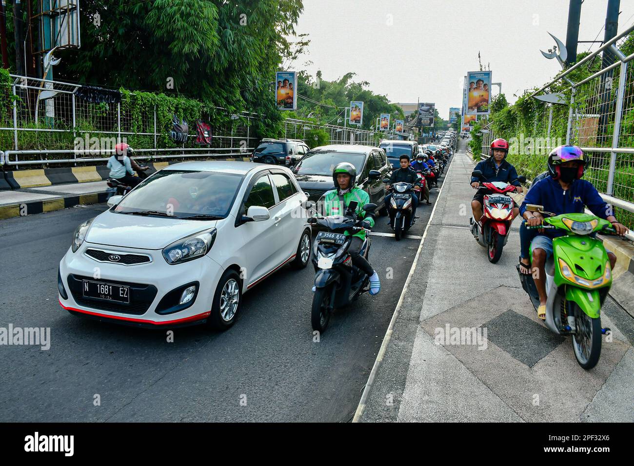 Malang, East Java, Indonesia. 16th Mar, 2023. People stuck in traffic ...