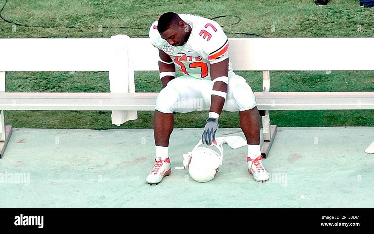 Oklahoma State full back Shawn Willis (37) sits alone on the bench ...