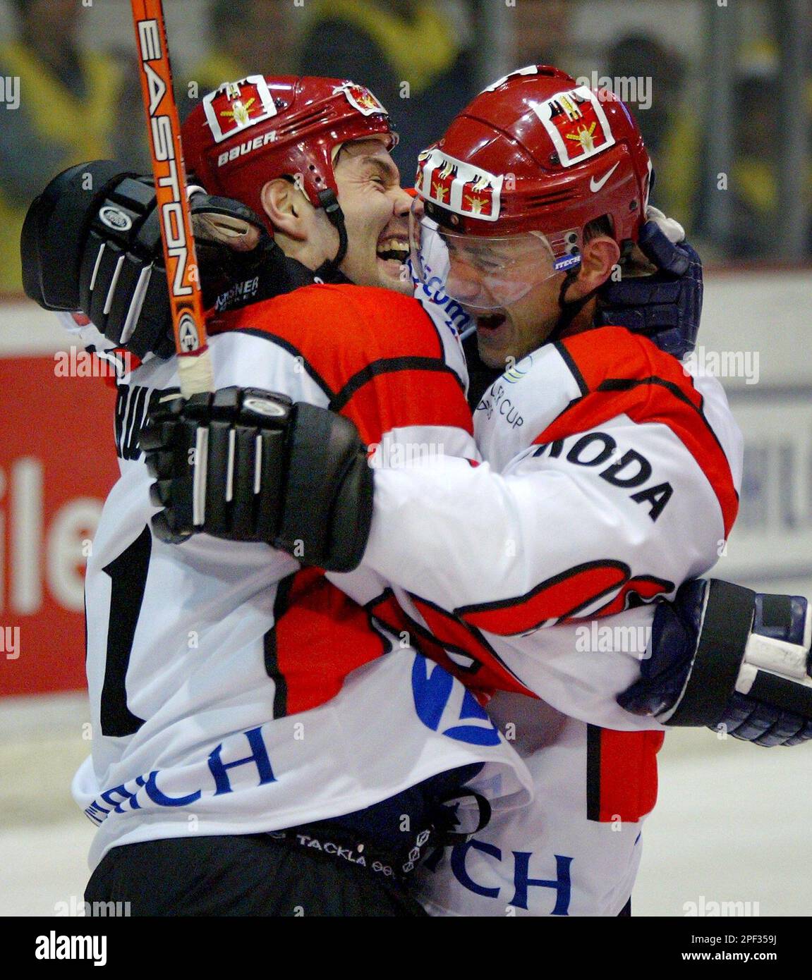 Team Canada's Jean-Guy Trudel, left, and Stacey Roest react after ...