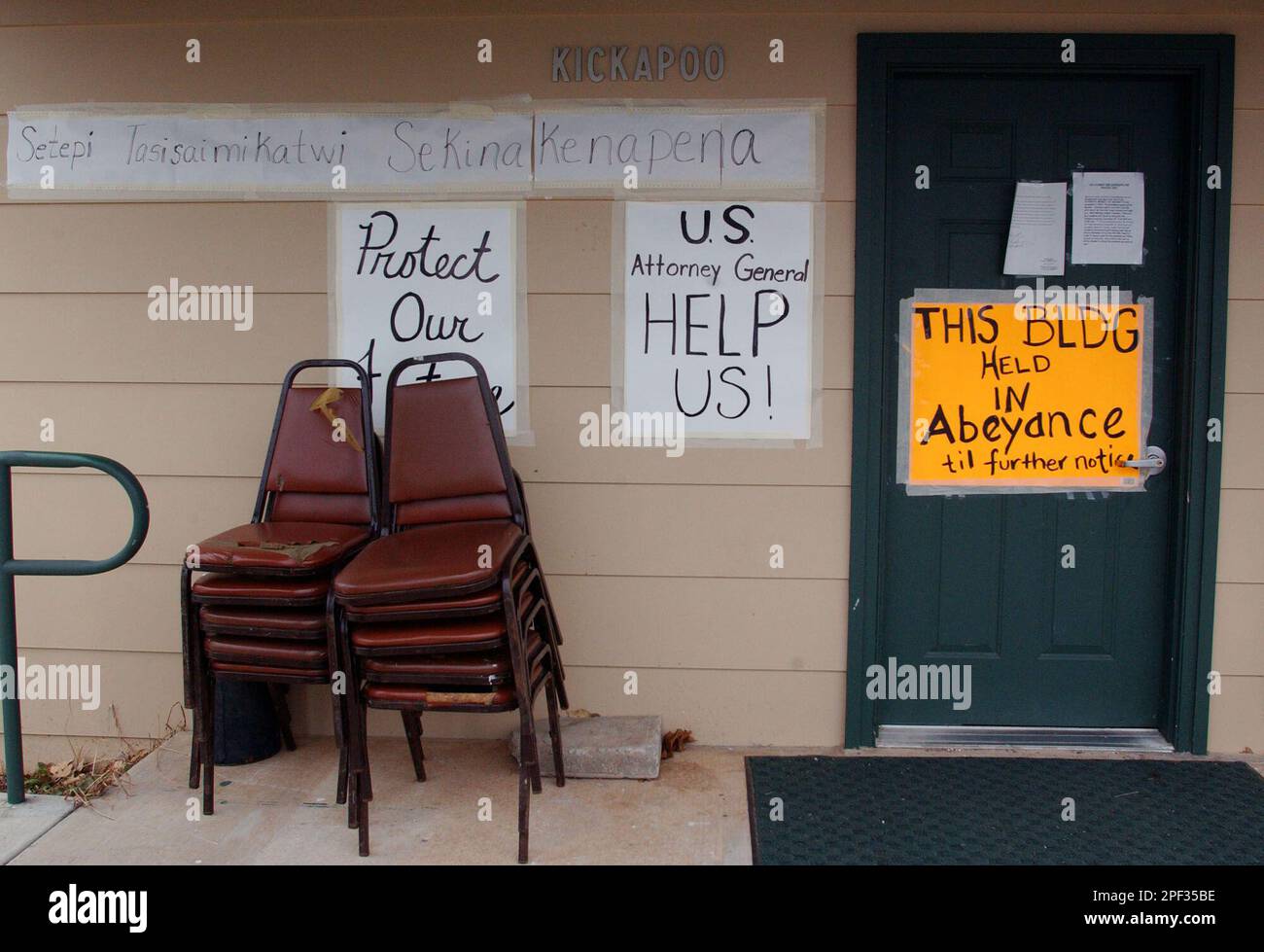 Signs hung by protesters adorn the front of the Kickapoo tribal ...