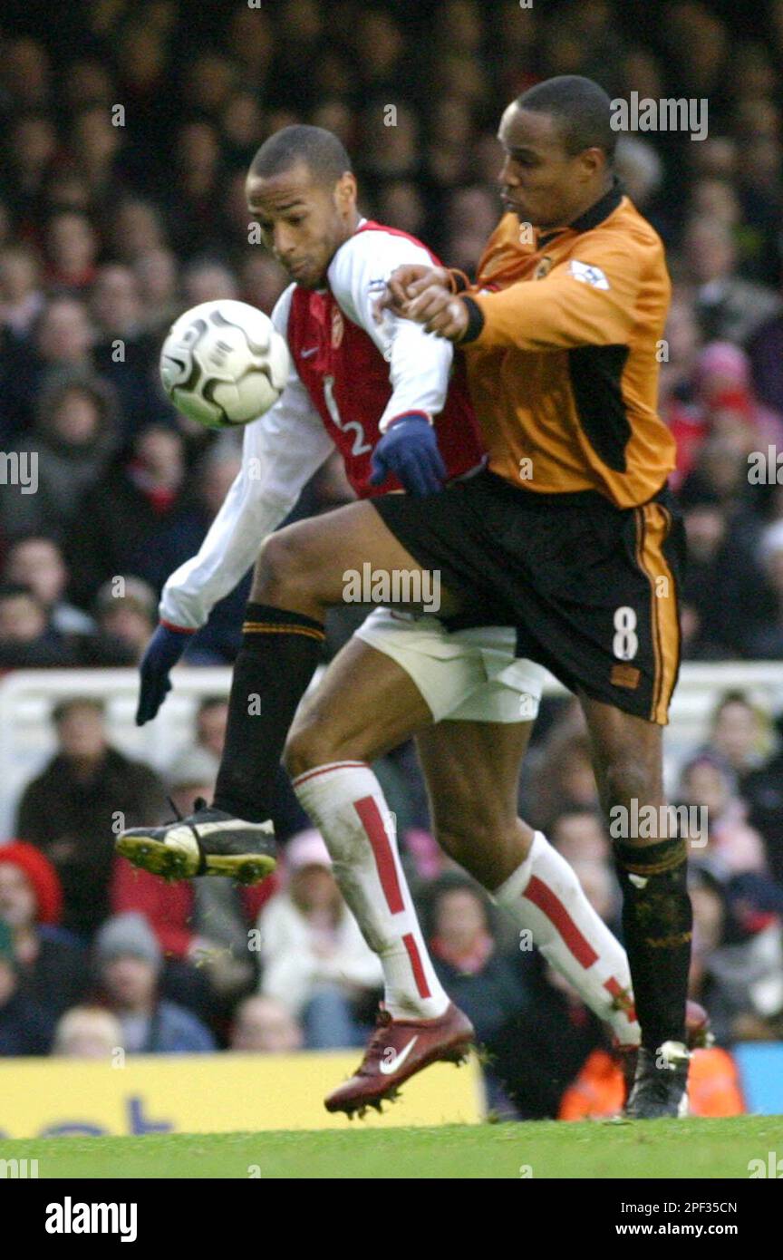 Arsenal's French forward Thierry Henry, left, tussles with Wolves ...