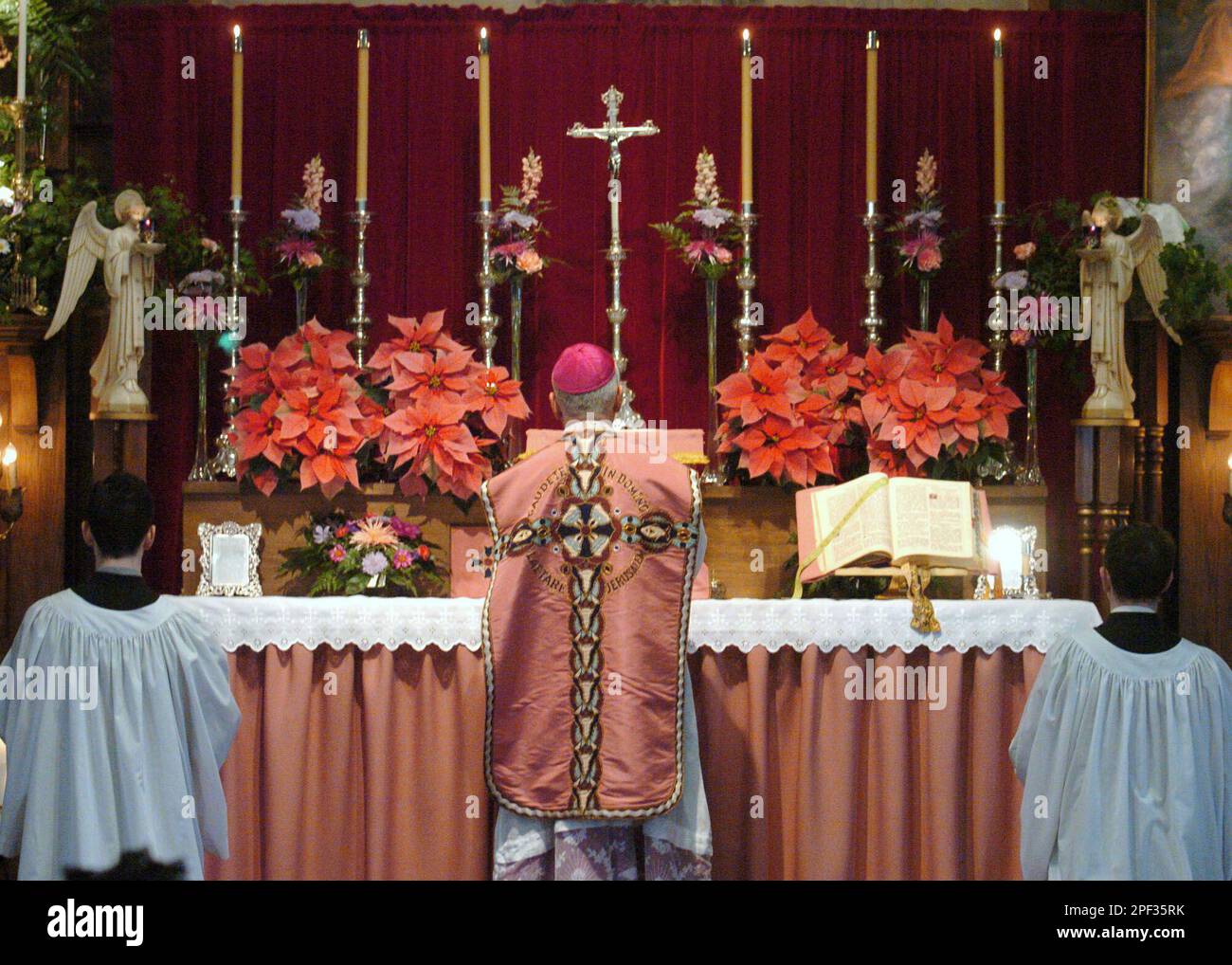 Bishop Daniel Dolan, center, performs a traditional Latin Mass at St ...