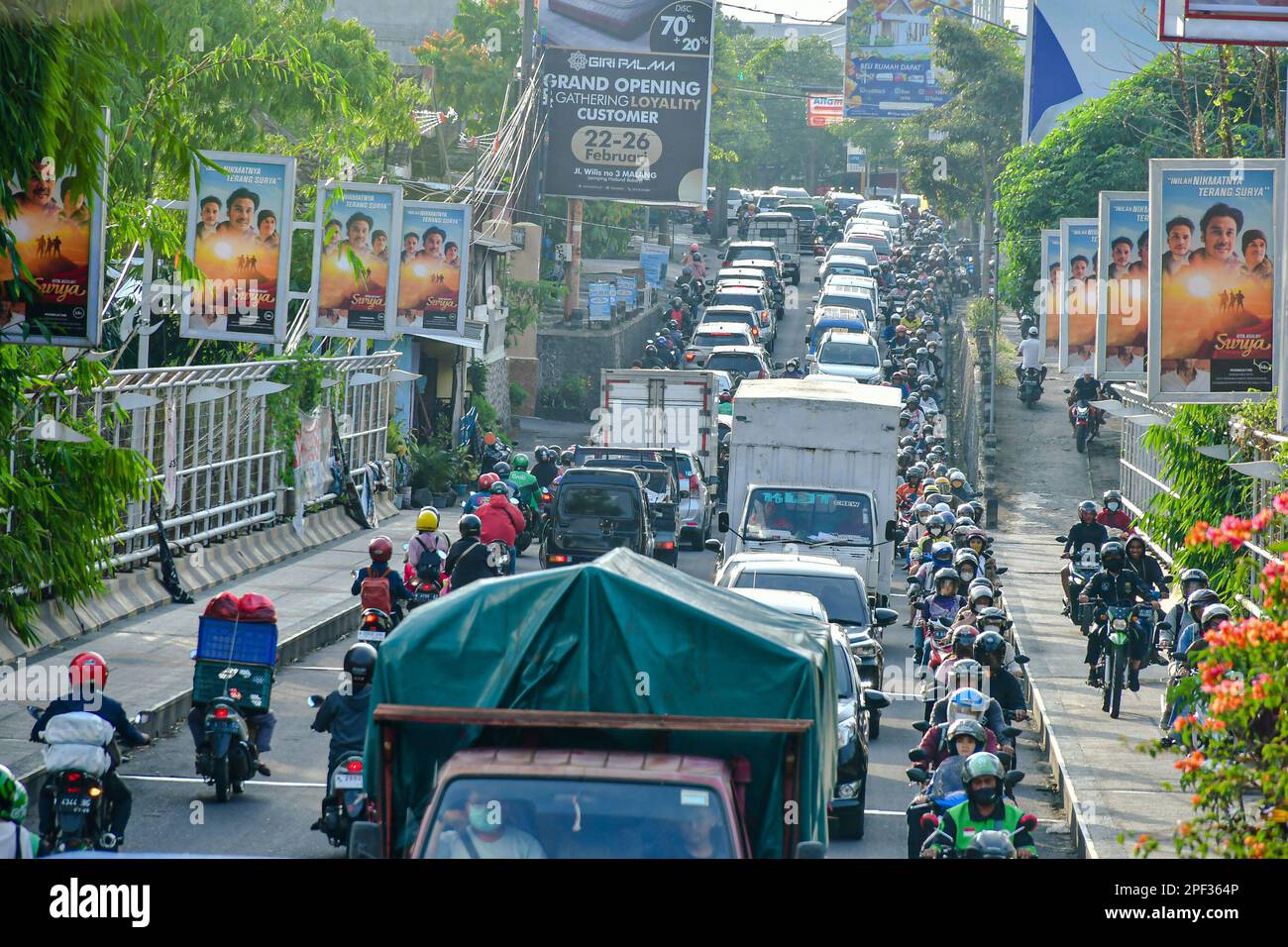 Malang, East Java, Indonesia. 16th Mar, 2023. People stuck in traffic ...