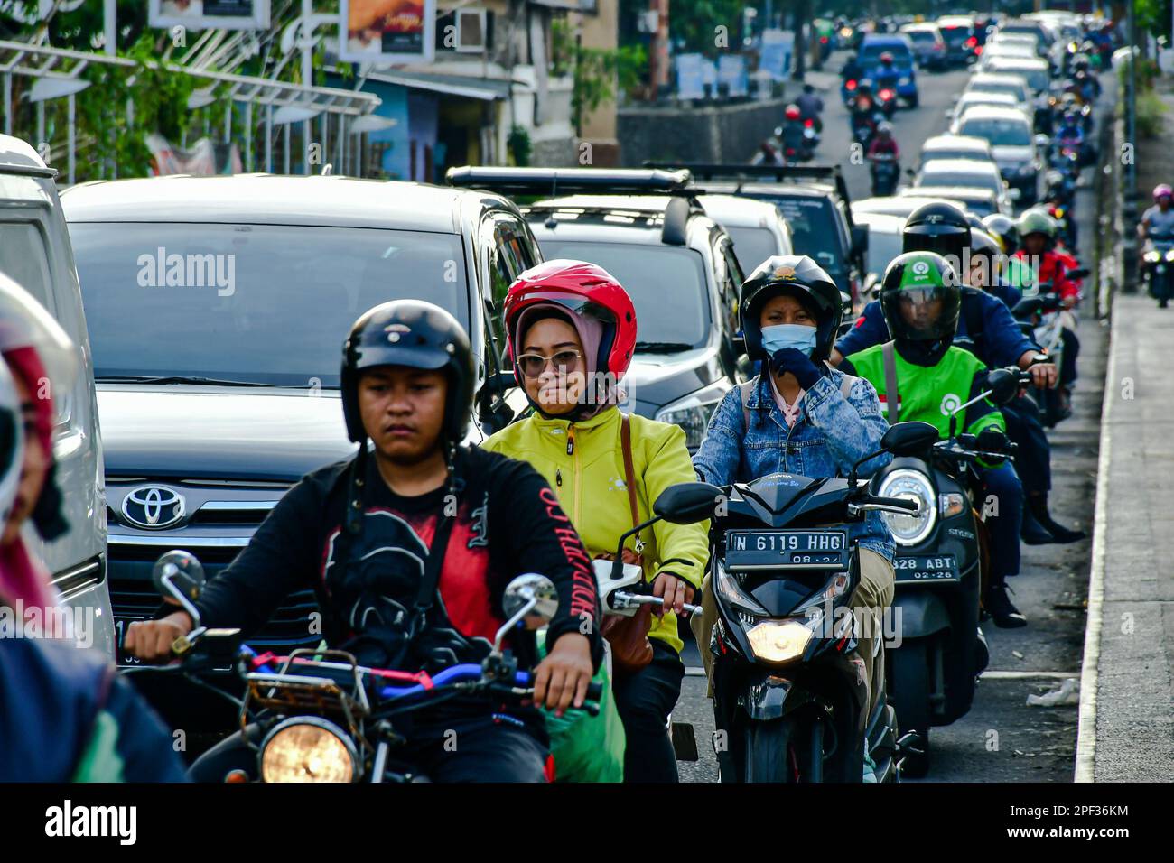 Malang, East Java, Indonesia. 16th Mar, 2023. People stuck in traffic ...
