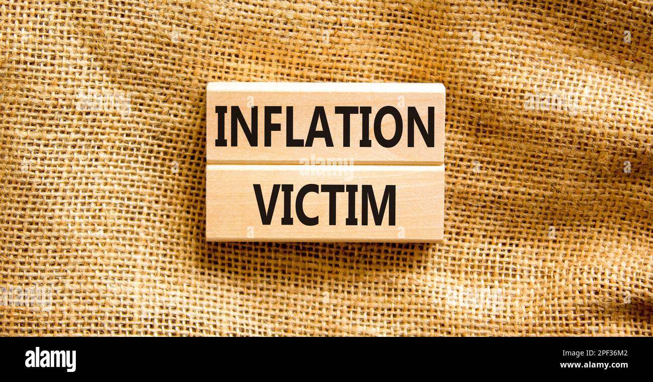 Inflation victim symbol. Concept words Inflation victim on wooden block ...