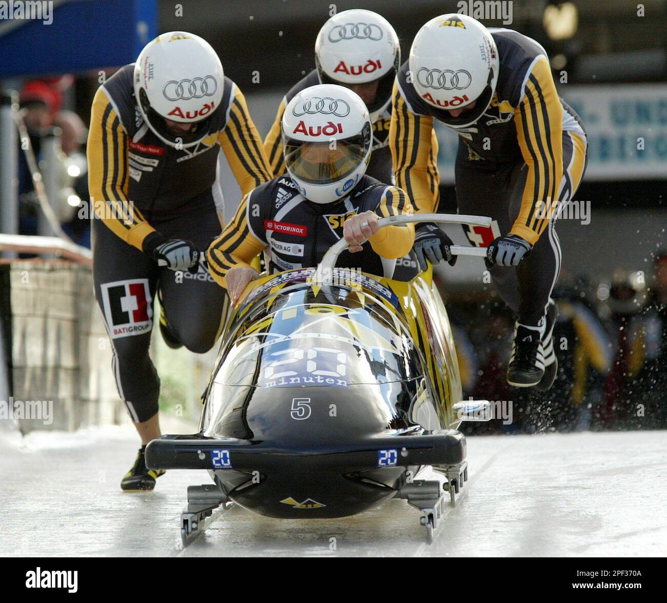 The Swiss 1 four-man bobsled team, piloted by Martin Annen with pushers Andreas Gees, Thomas ...