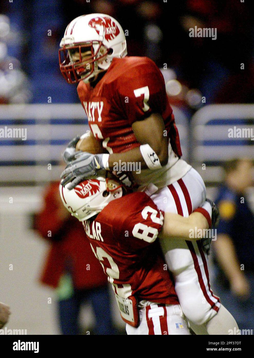 Katy wide receiver Chris Pedlar (82) lifts Ryan Mouton (7) after he ...
