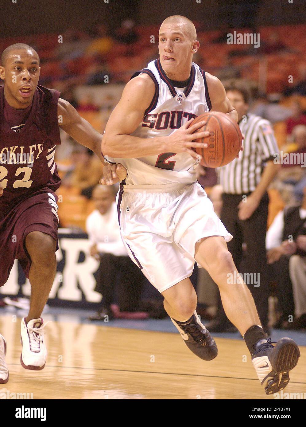 Parkersburg South's Ryan Dawson drives on Woodrow Wilson's Corey ...