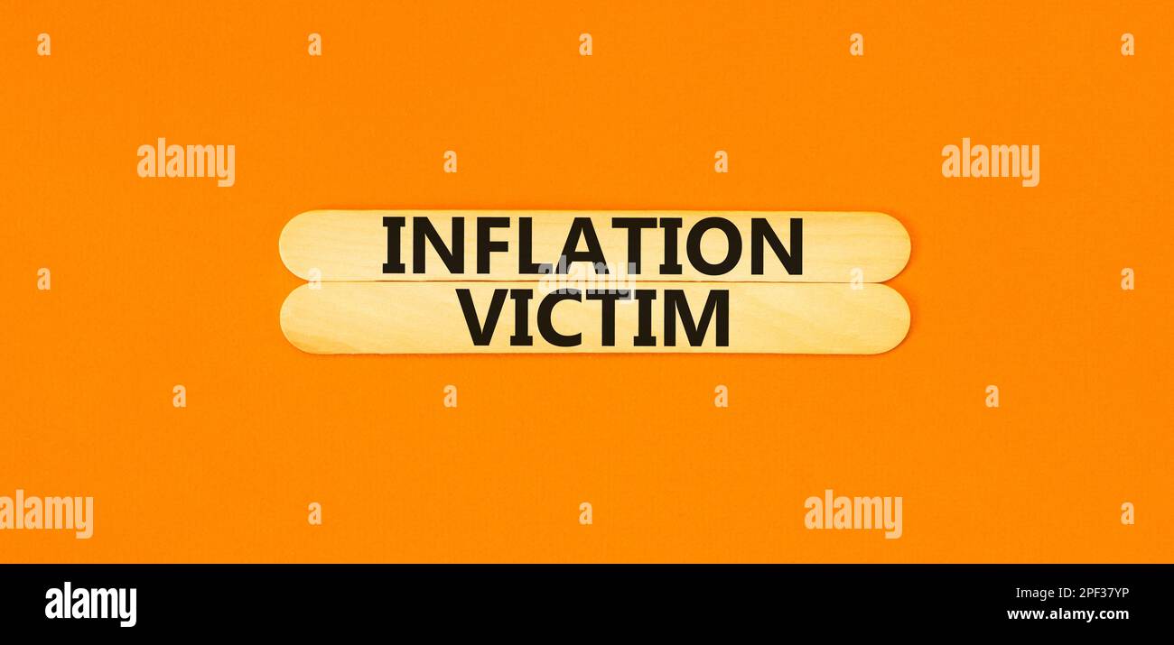 Inflation victim symbol. Concept words Inflation victim on wooden ...