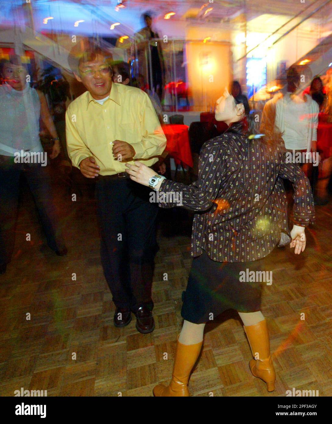 A middle-aged Japanese couple dance at disco Byblos in Tokyo Thursday ...