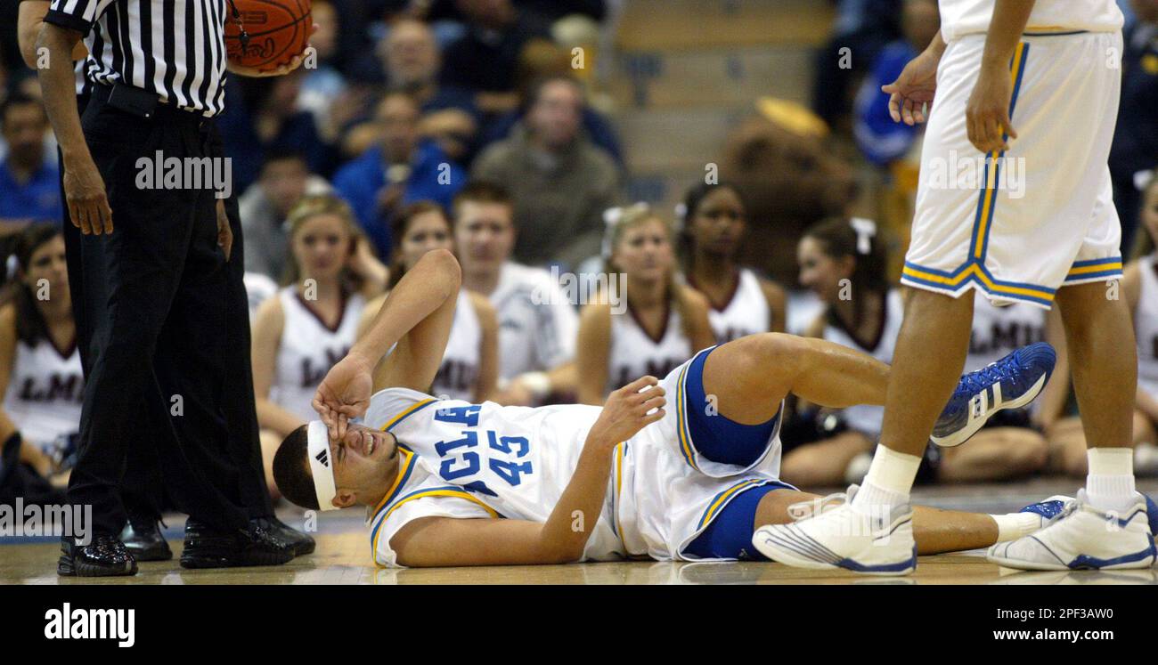 UCLA's Michael Fey (45) reacts after being poked in the eye during the ...