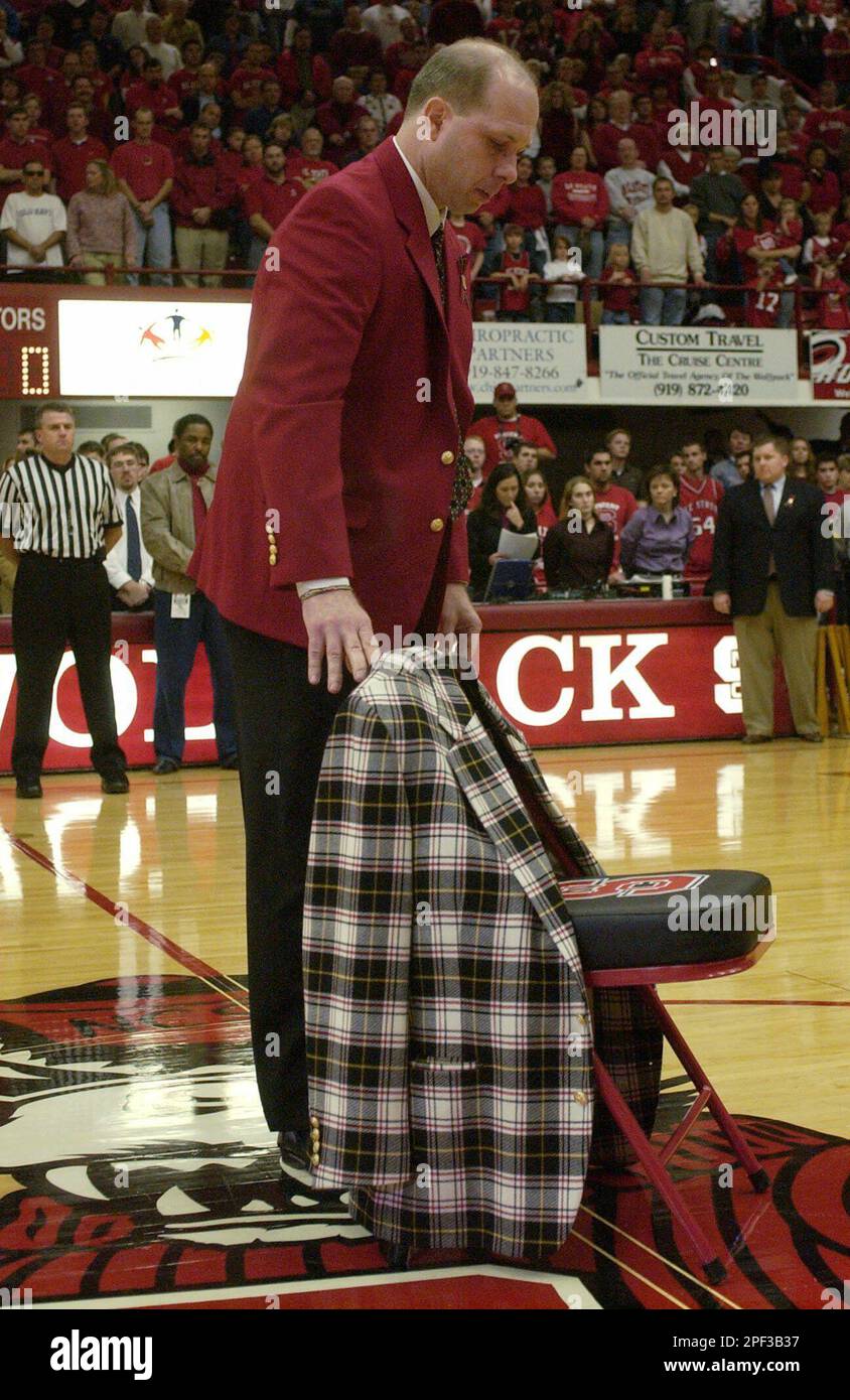 North Carolina State coach Herb Sendek places a jacket formerly worn by ...