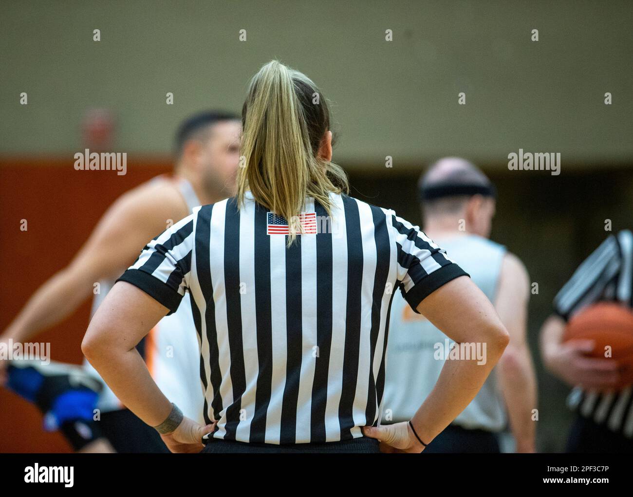 Female referee at a basketball game Stock Photo - Alamy