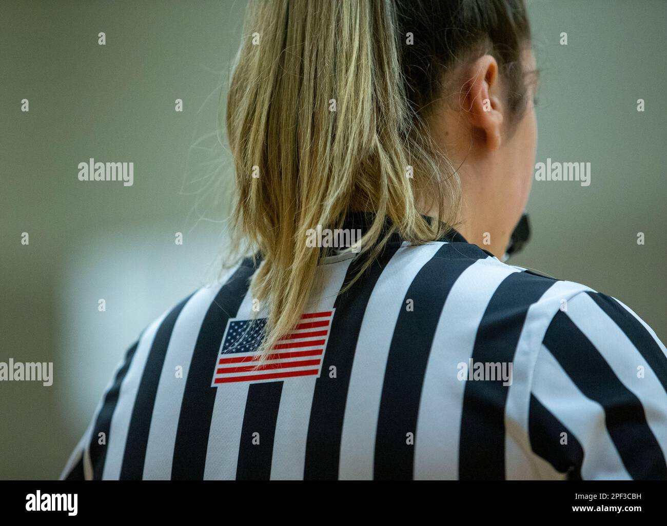 Female referee at a basketball game Stock Photo - Alamy