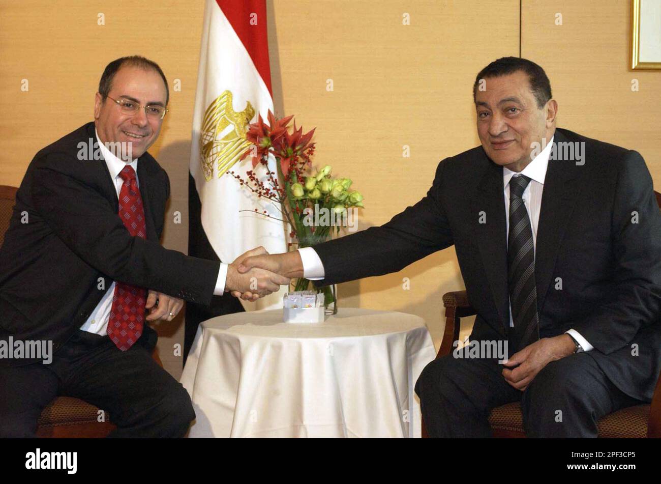 Israeli Foreign Minister Silvan Shalom, left, shakes hands with ...