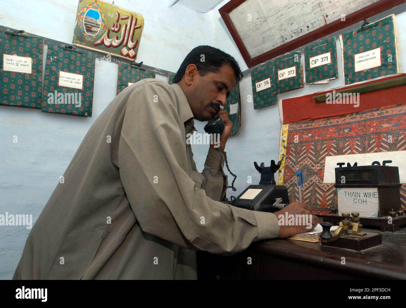 Station master Aminullah communicates at newly renovated control room ...