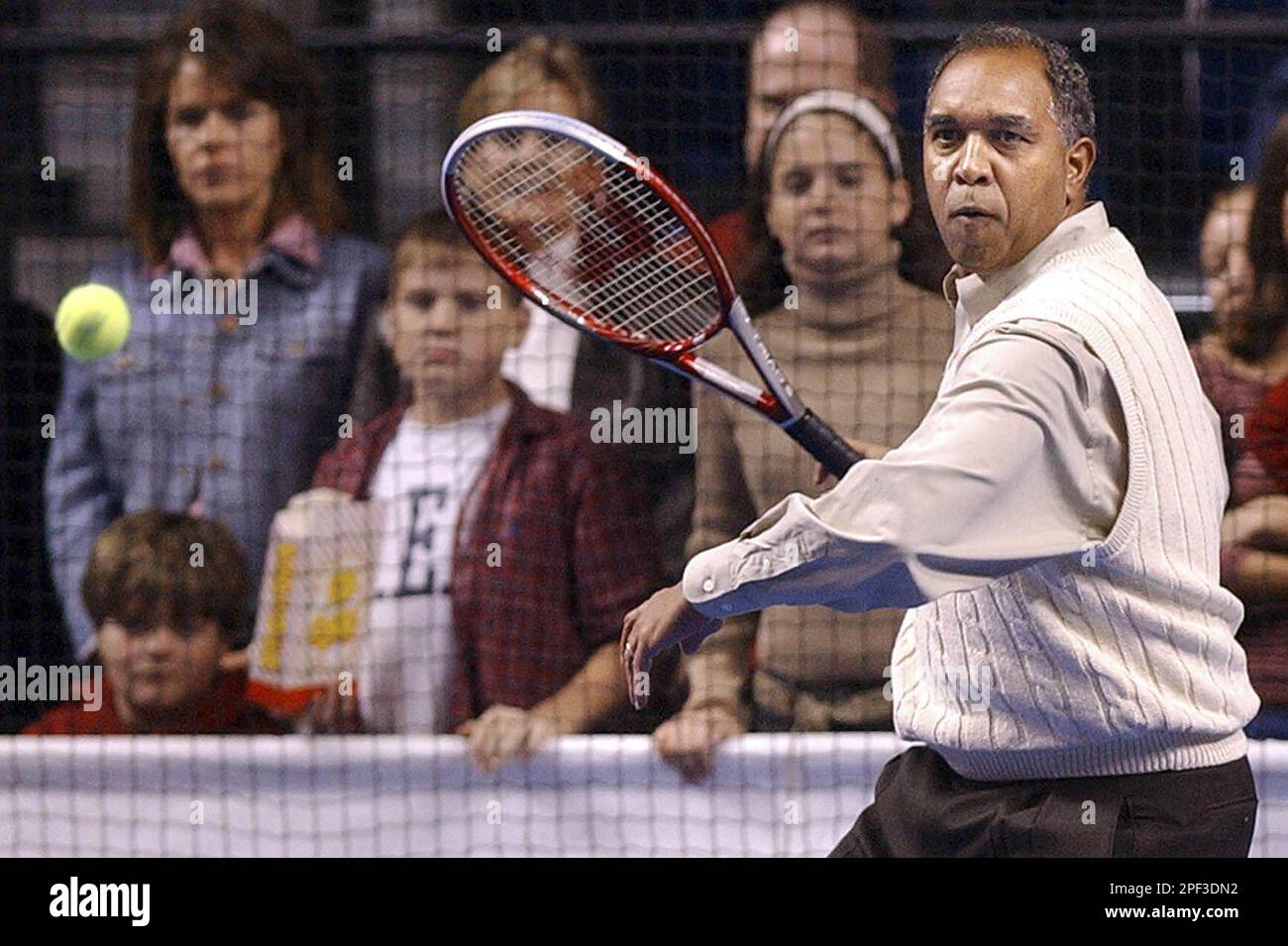 Kentucky basketball coach Tubby Smith returns a serve from Andy Roddick ...