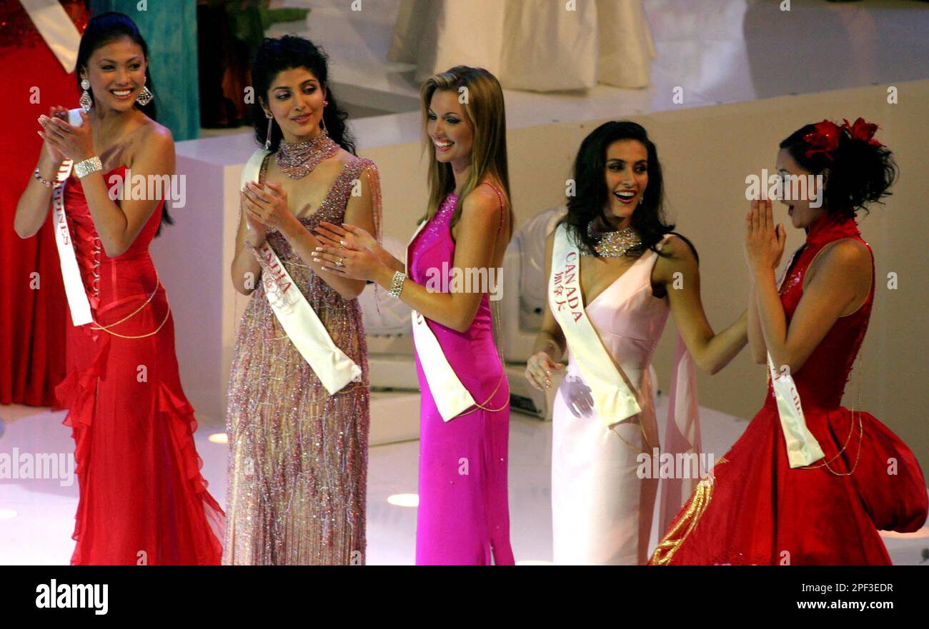 Miss China Qi Guan, right, reacts as she is named second runner-up ...