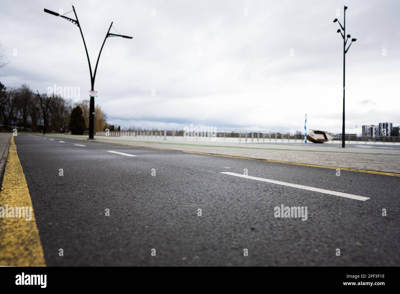Running and cycling paths along the city alley embankment. Lake ...