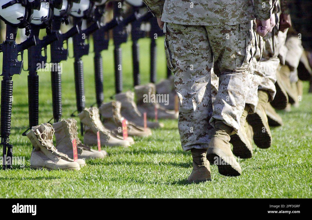 Marines march near boots representative of the the Marines from the ...