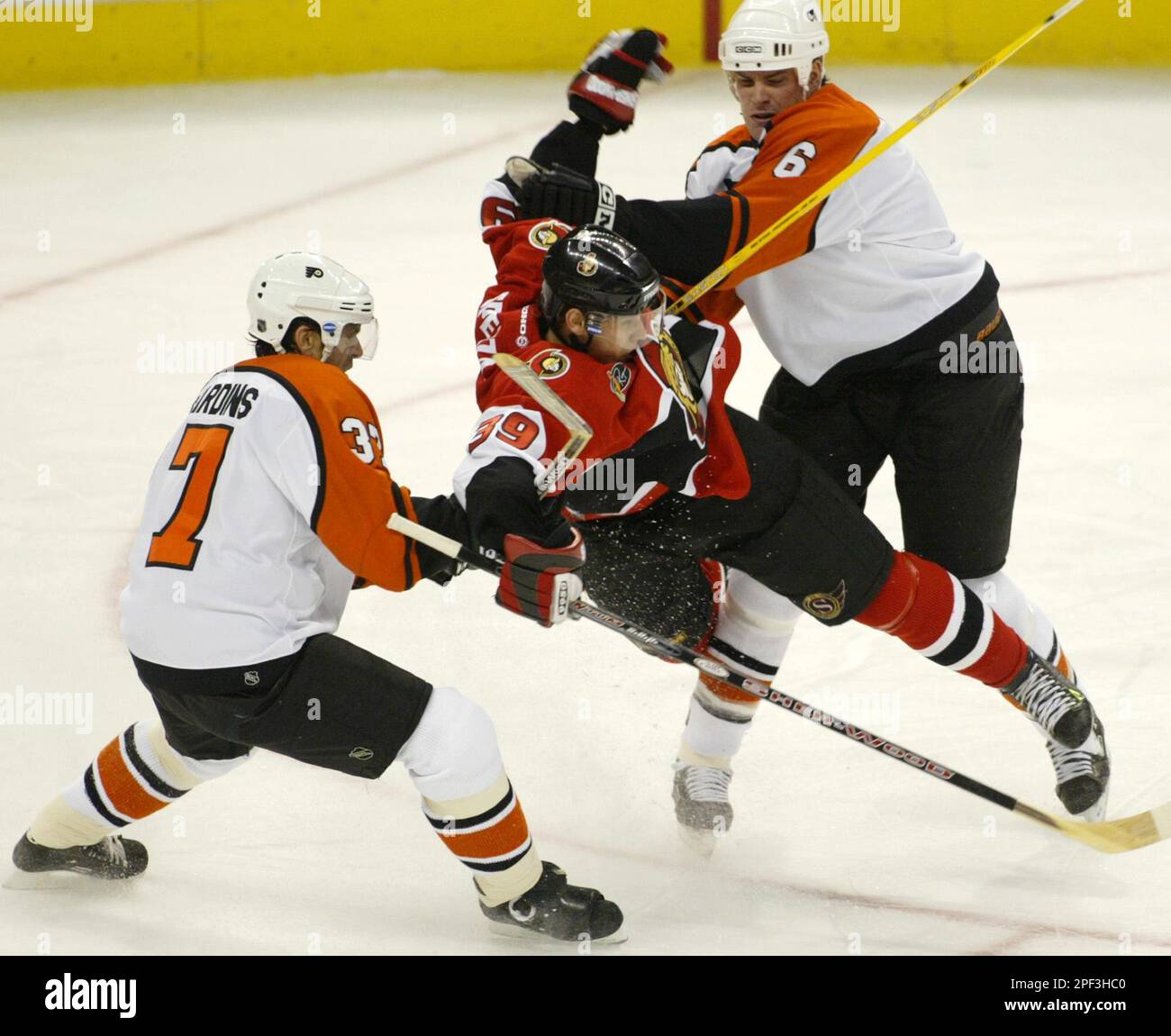 Ottawa Senators Jason Spezza gets crushed by Philadelphia Flyers Eric ...