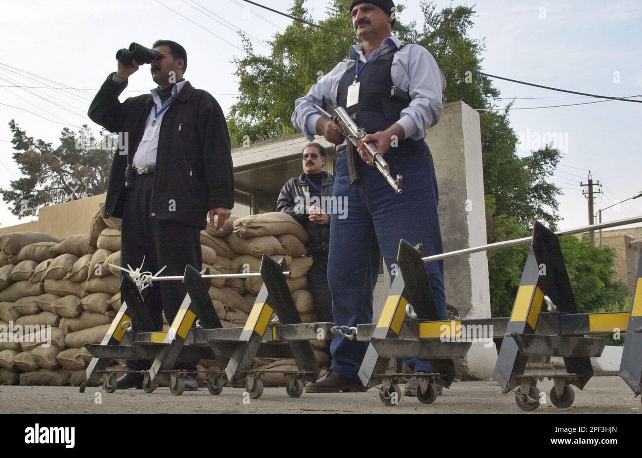 Iraqi armed guards secure the Japanese embassy in Baghdad, Monday, Dec ...