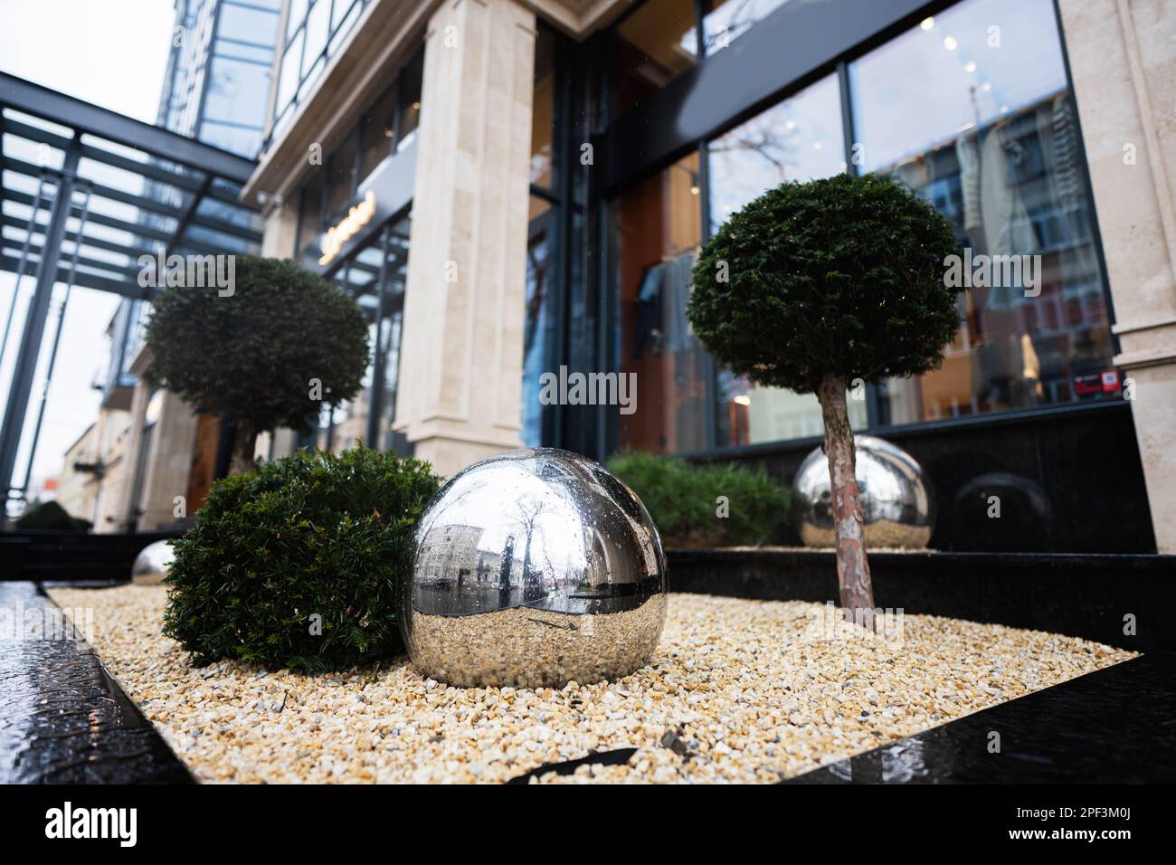 Shiny metallic mirror reflection balls, urban decoration of modrern buildings Stock Photo - Alamy